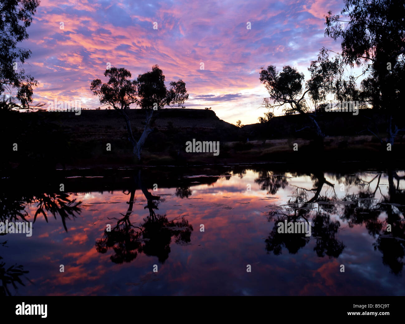 Sunset on a water hole (Billabong), Nullagine, Northwest Australia ...