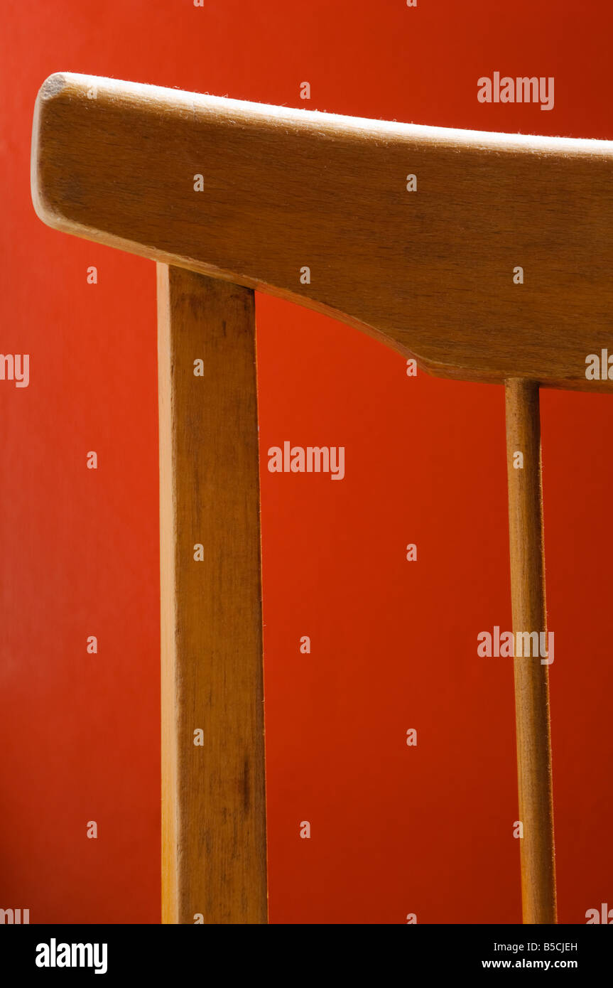 Wooden chair with red background Stock Photo - Alamy