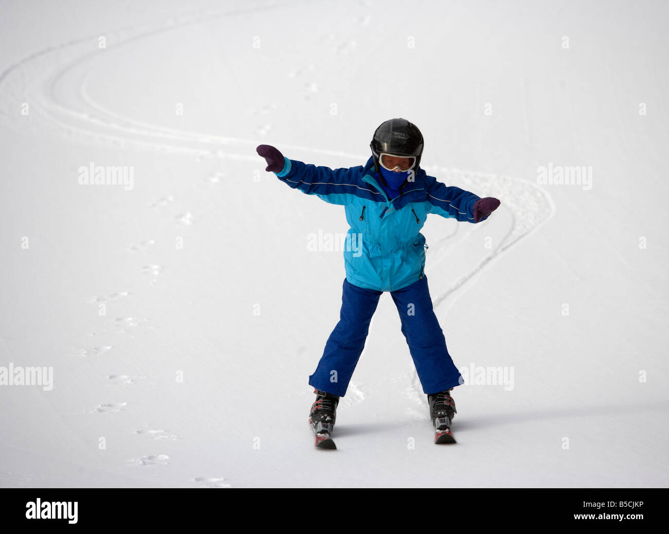 Child skiing on a hill Stock Photo - Alamy