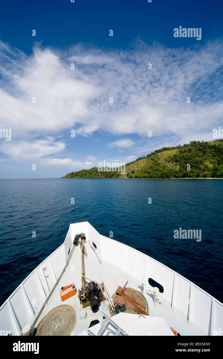 View of a diving ship bow against a blue sky with beautiful cloudscape ...