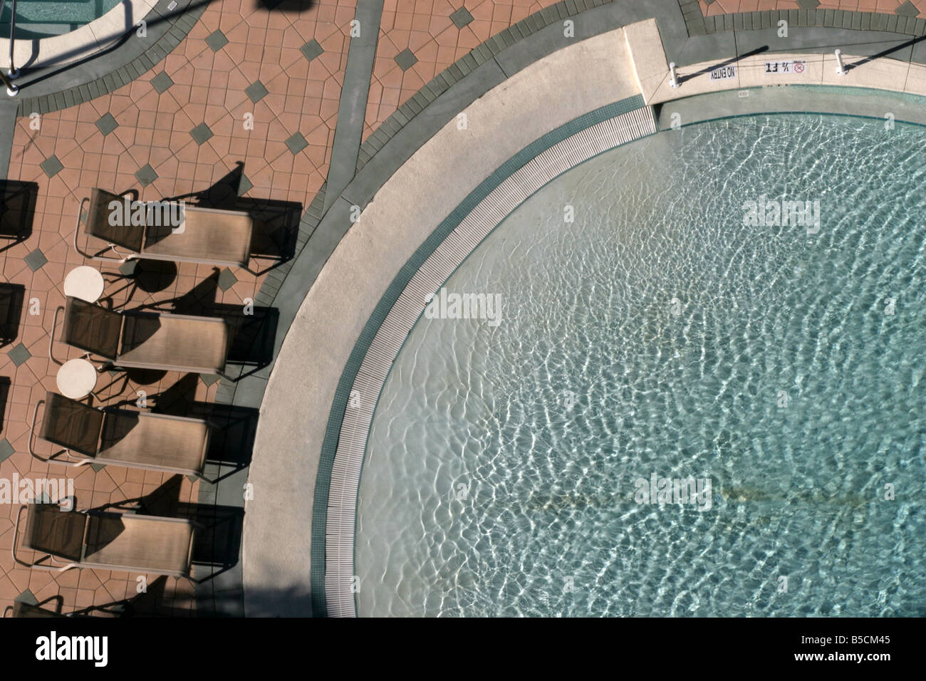 Sunbathing by the pool Stock Photo - Alamy