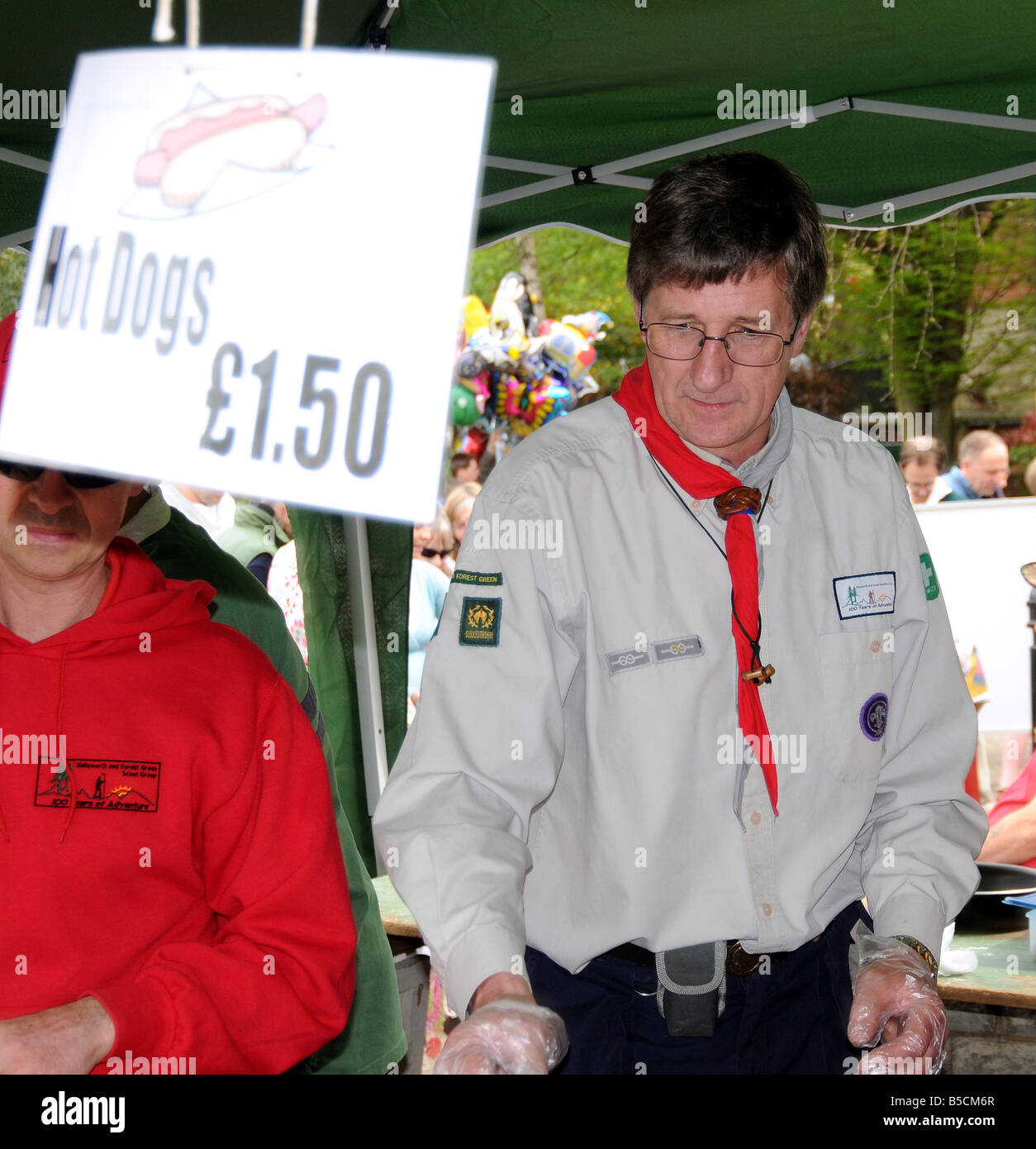 Boy Scouts Leader selling hot dogs Stock Photo - Alamy
