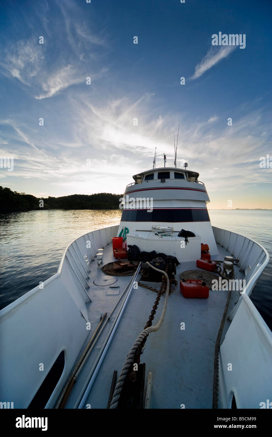 View of a diving ship bow against a blue sky with beautiful cloudscape ...