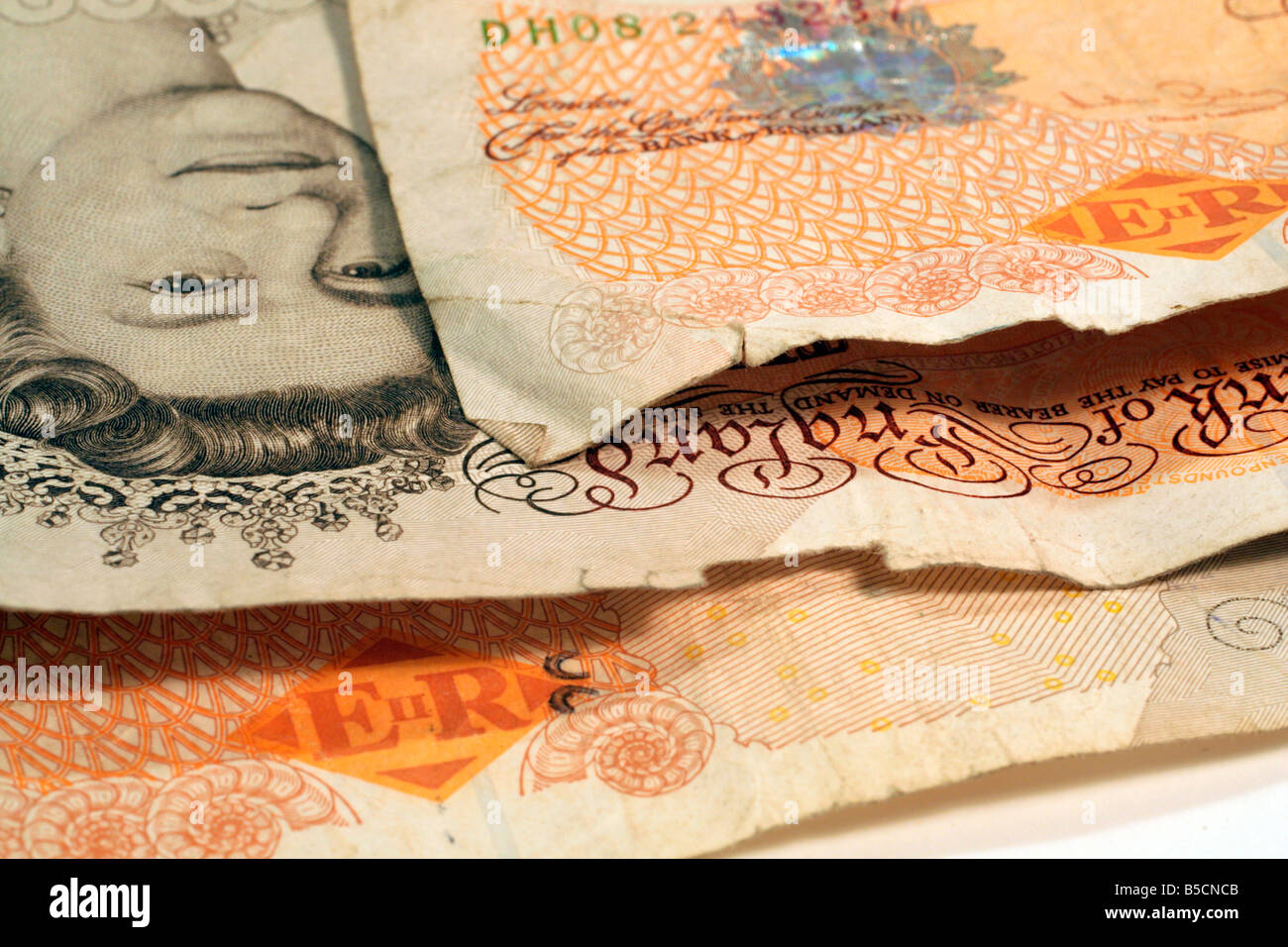 Old Ten pound notes still in circulation frayed torn and dirty at the ...