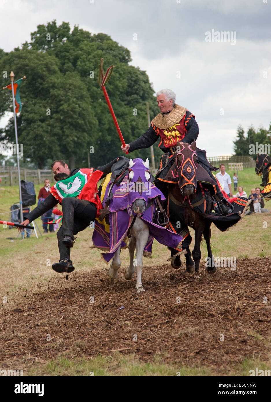 Knight falling off his horse at a joust after being attacked by another ...
