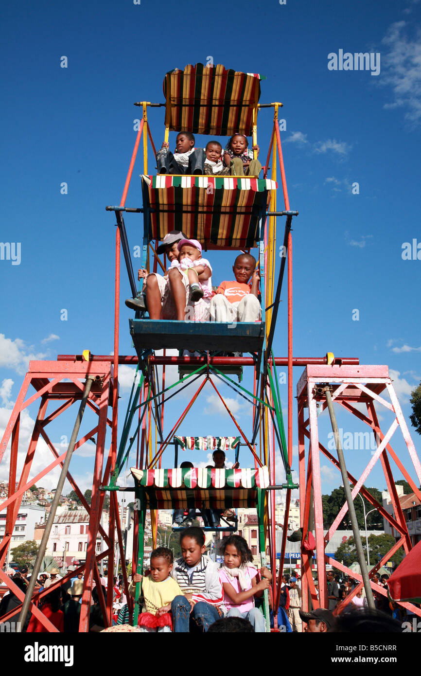 Kids in a carousel at the traditional May fair of Antanarivo Madagascar ...
