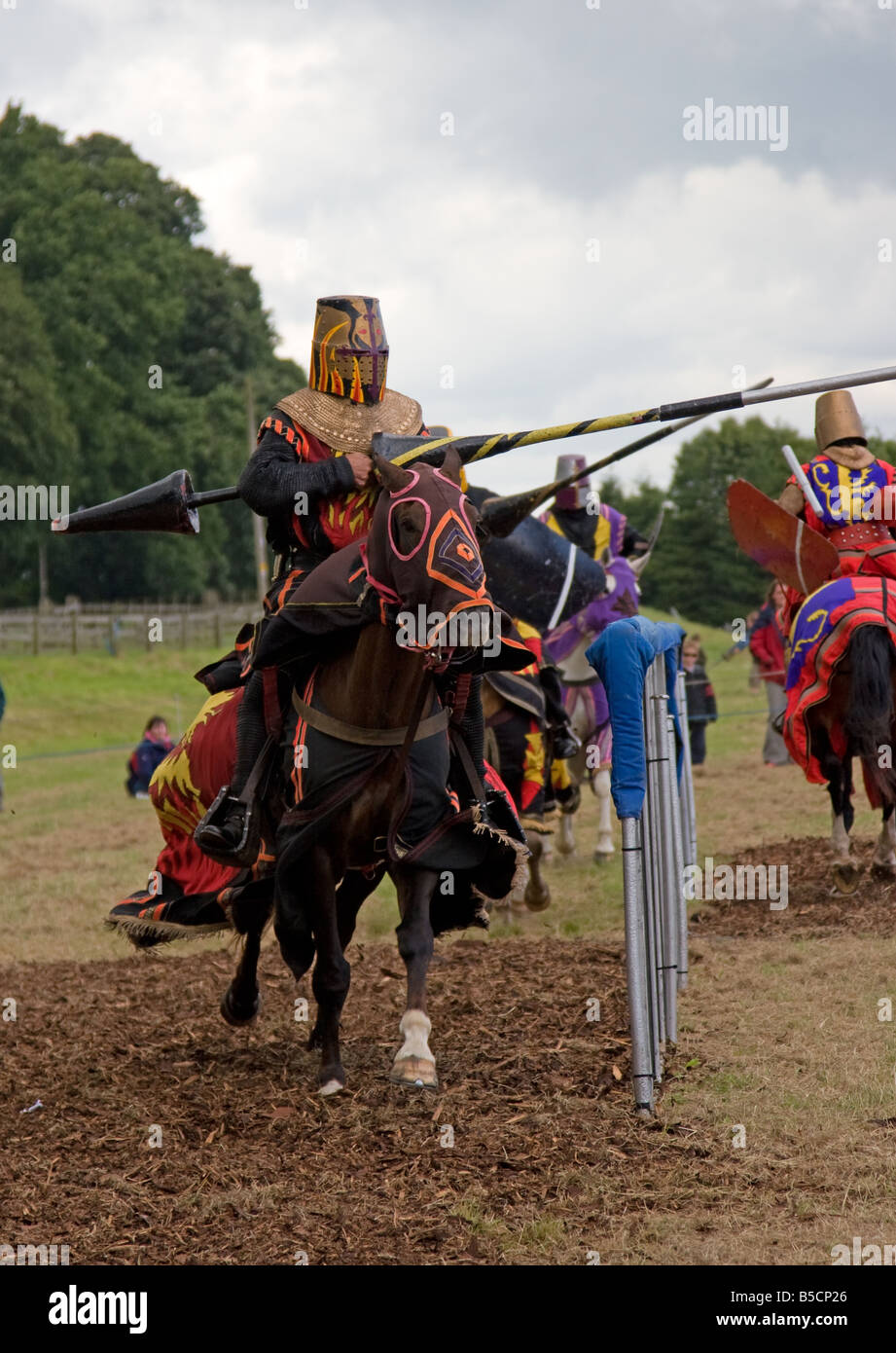 Knight charging at a joust Stock Photo - Alamy