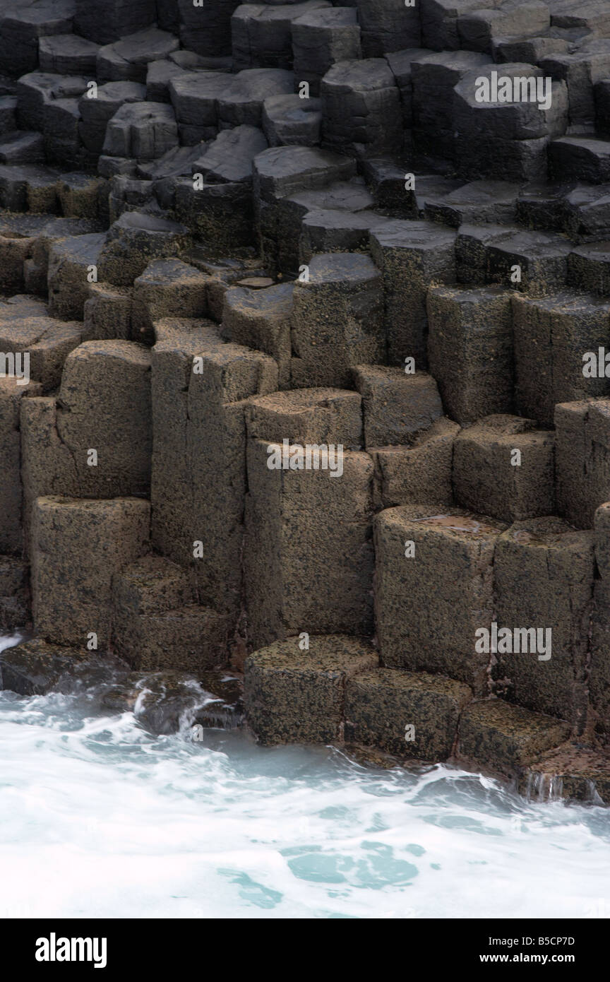 basalt rock columns emerging from the sea on the island of staff in ...