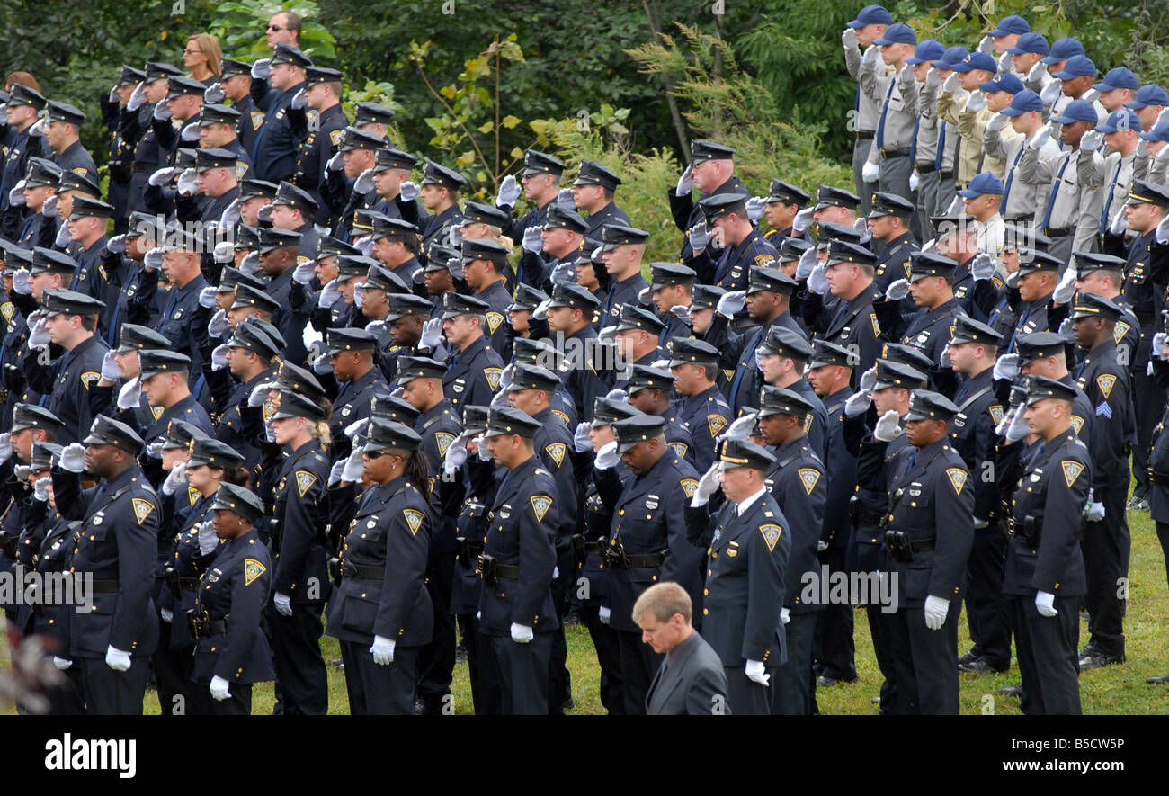 Police officers mourn the loss of one of their own who was killed ...