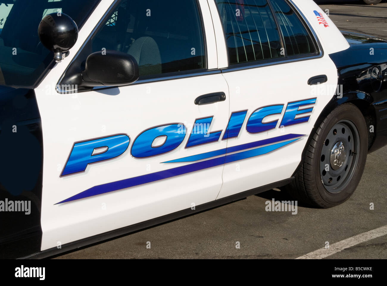 A new police car sitting in a parking lot awaits a driver Stock Photo ...