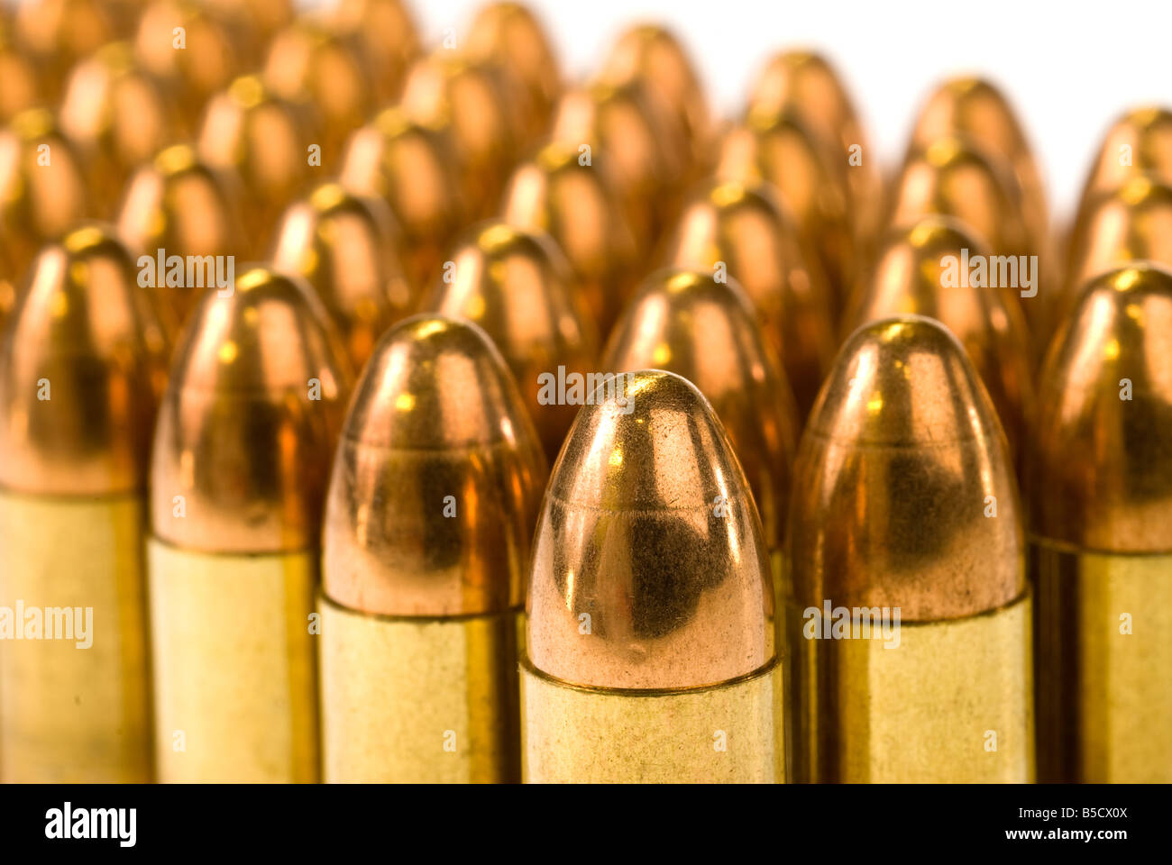 Rows of 45 caliber bullets isolated against a white background Stock ...