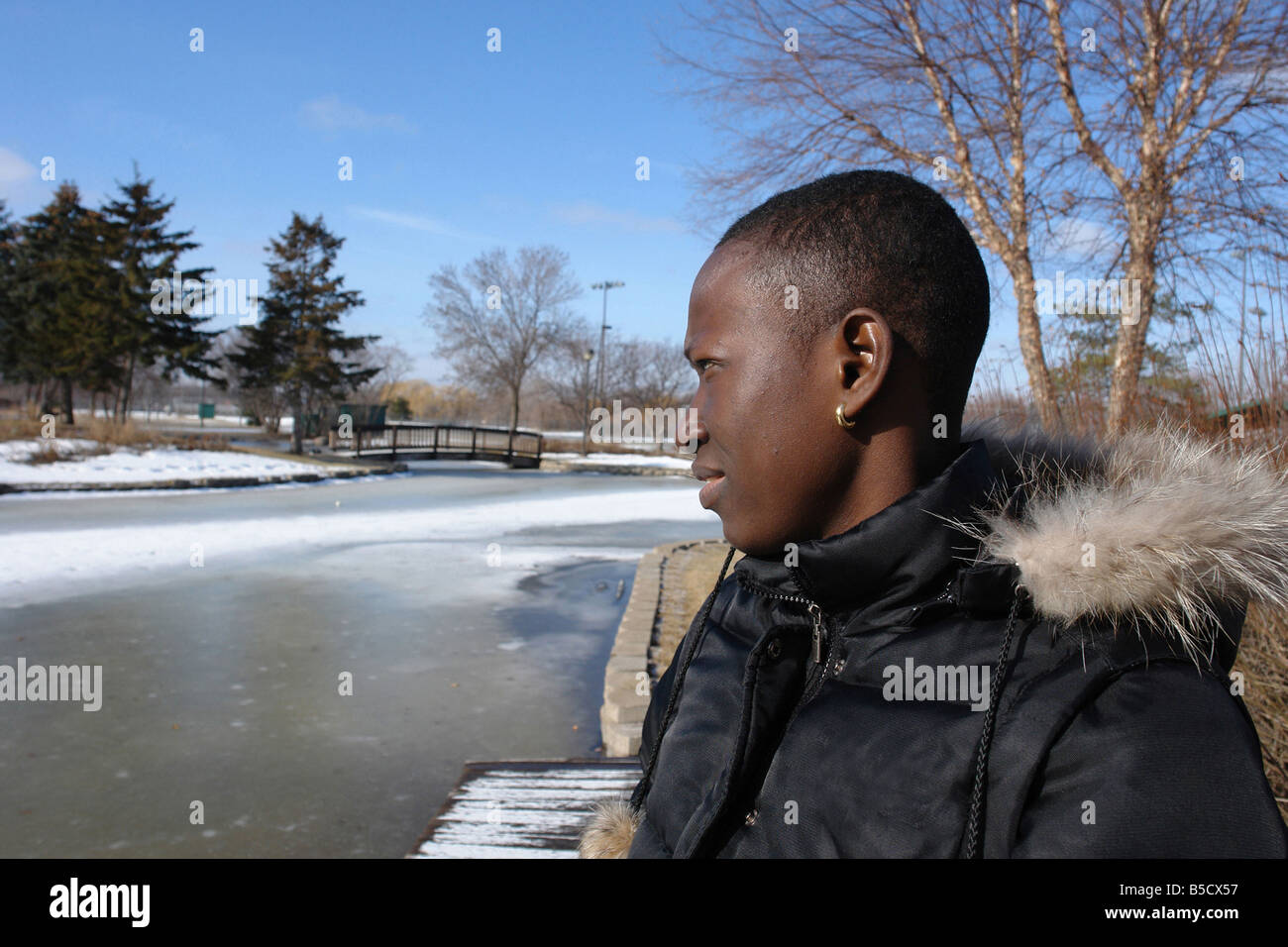 Woman looking over winter landscape Stock Photo - Alamy