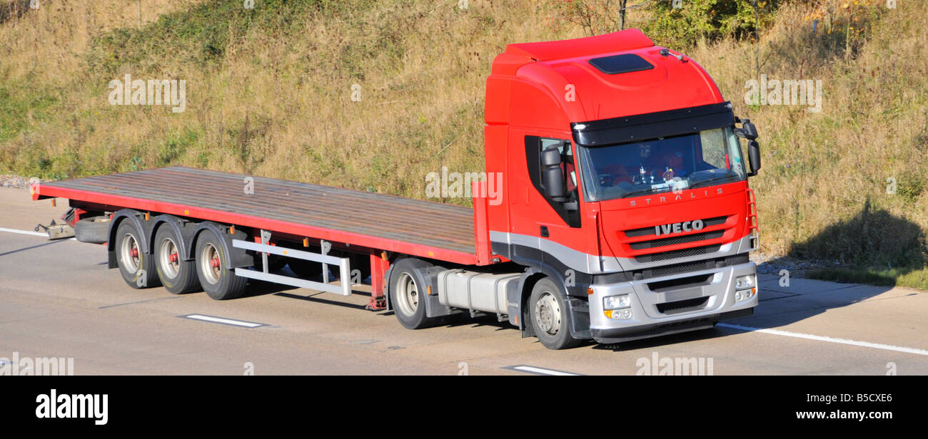 M25 motorway flat back lorry travelling empty Stock Photo - Alamy