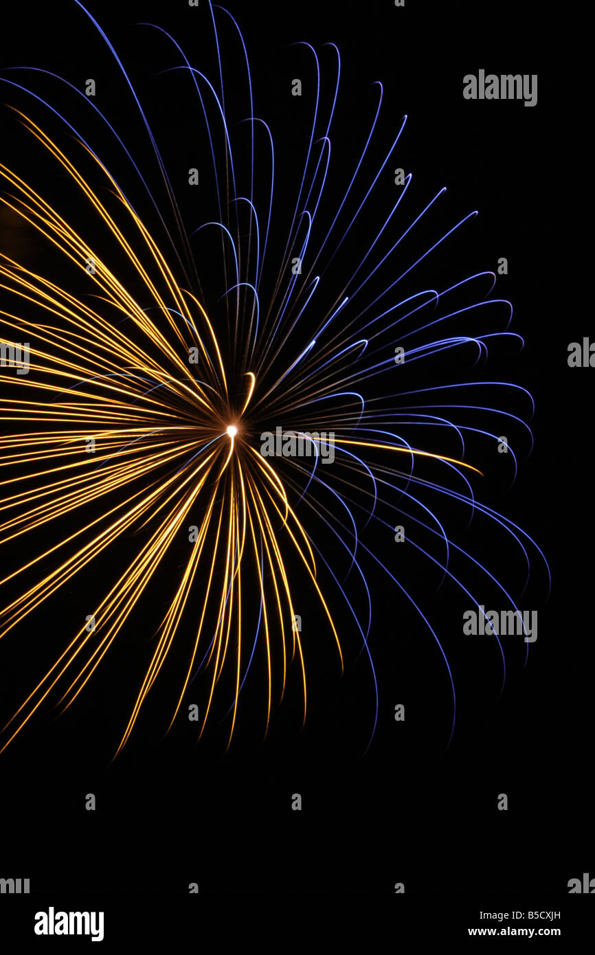 Blue & Yellow Fireworks Burst Stock Photo - Alamy