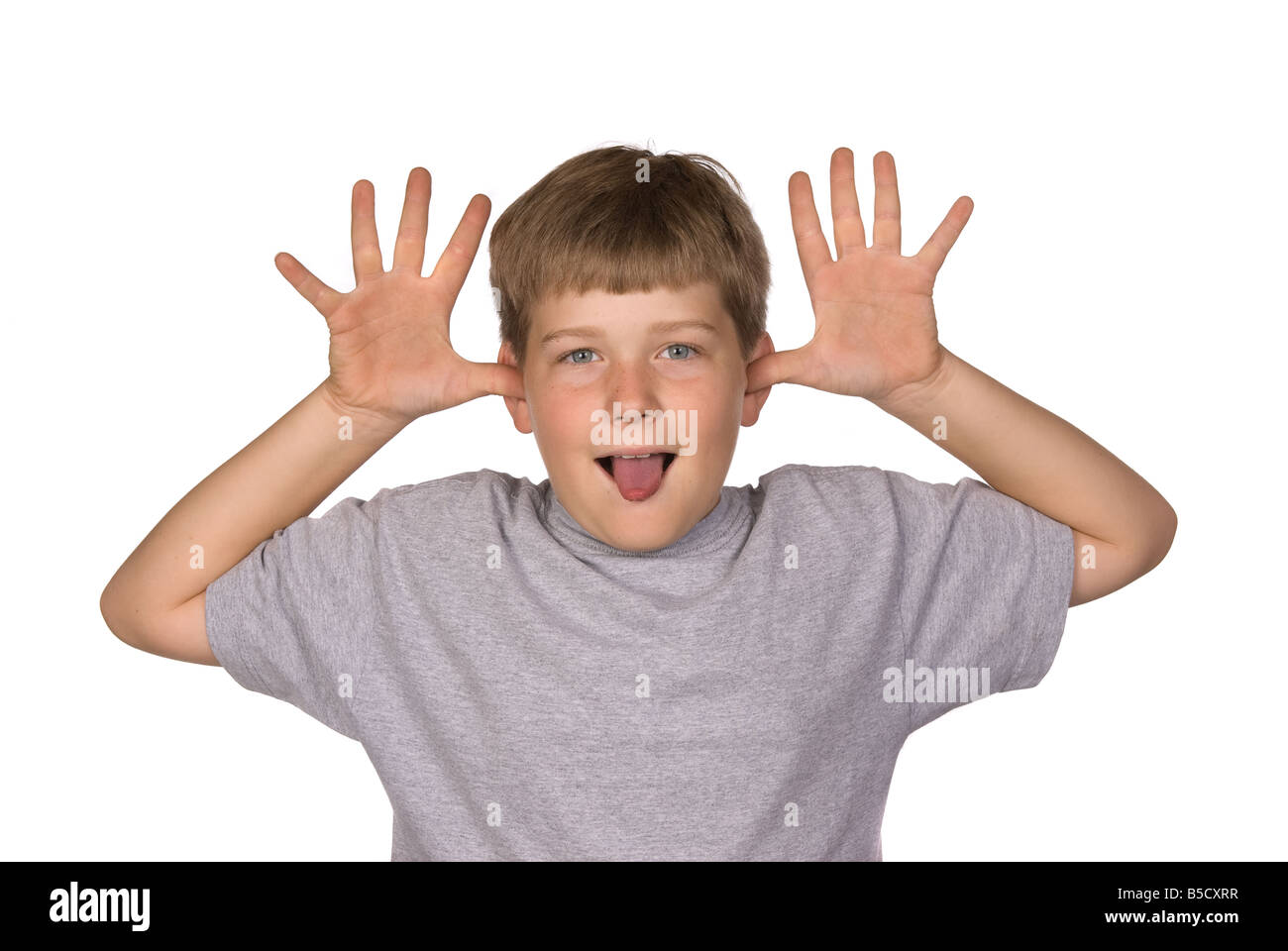 A young boy makes a face and mocks the camera Stock Photo - Alamy