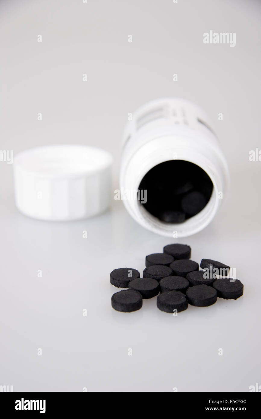 Plastic bottle with medicinal activated charcoal tablets Stock Photo ...