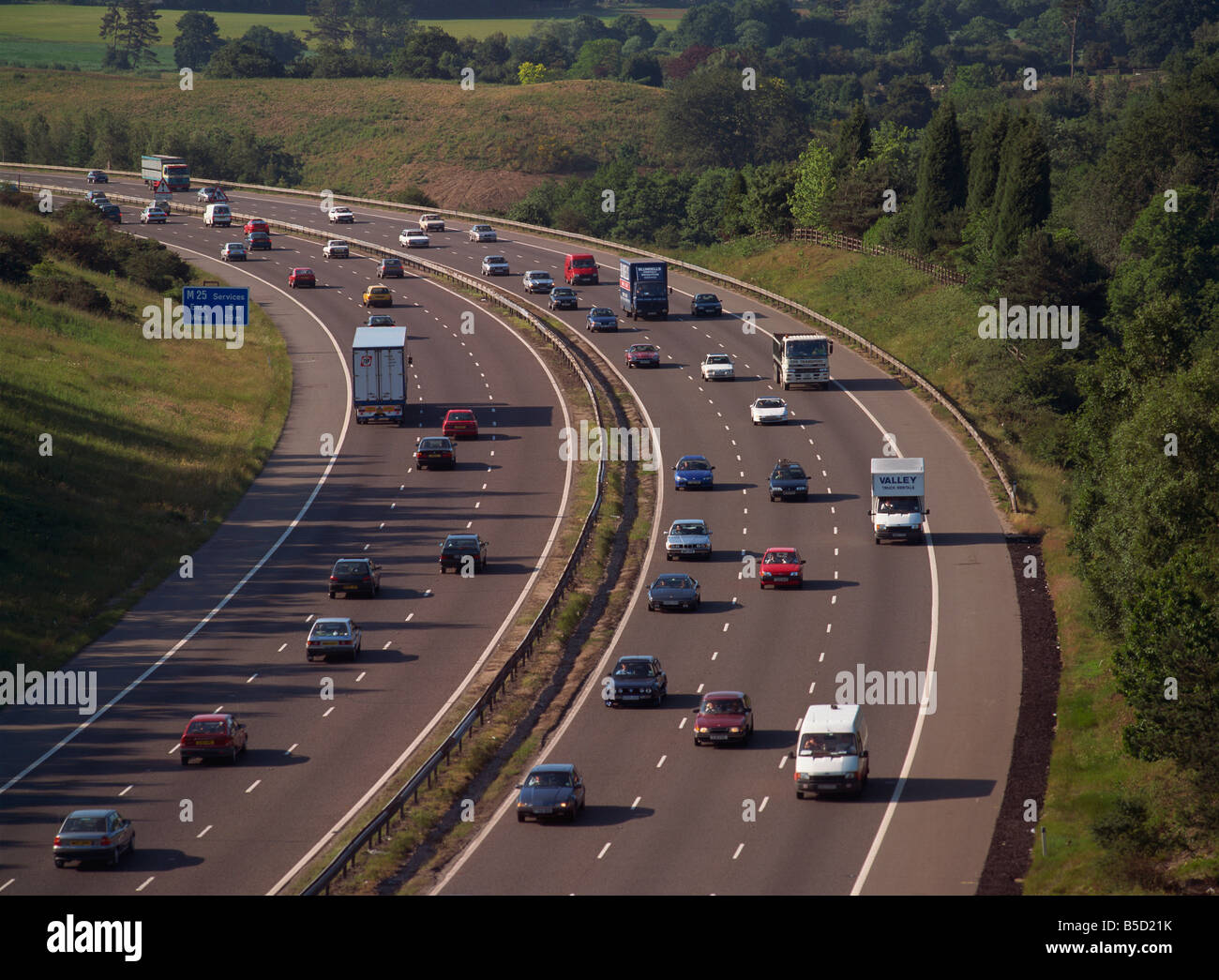 Vans cars and lorries on the M25 motorway in England J Miller Stock ...