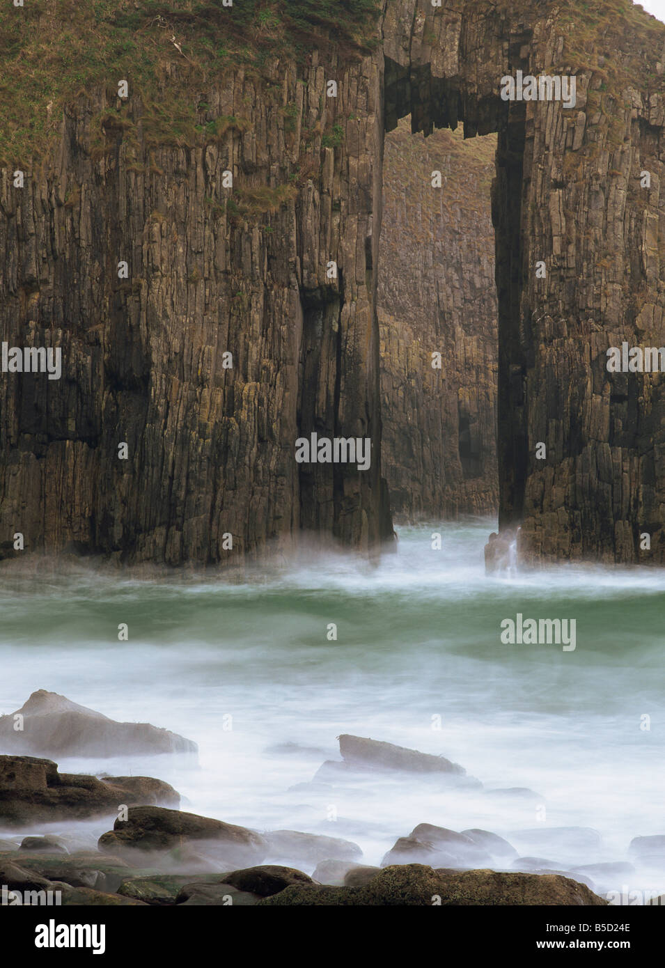 Church Doors rock formation in Skrinkle Haven cove with surf washing ...