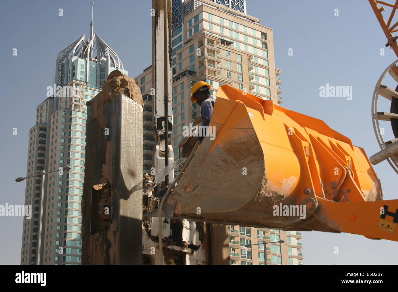 Worker in mechanical digger bucket dubai metro construction site Stock ...