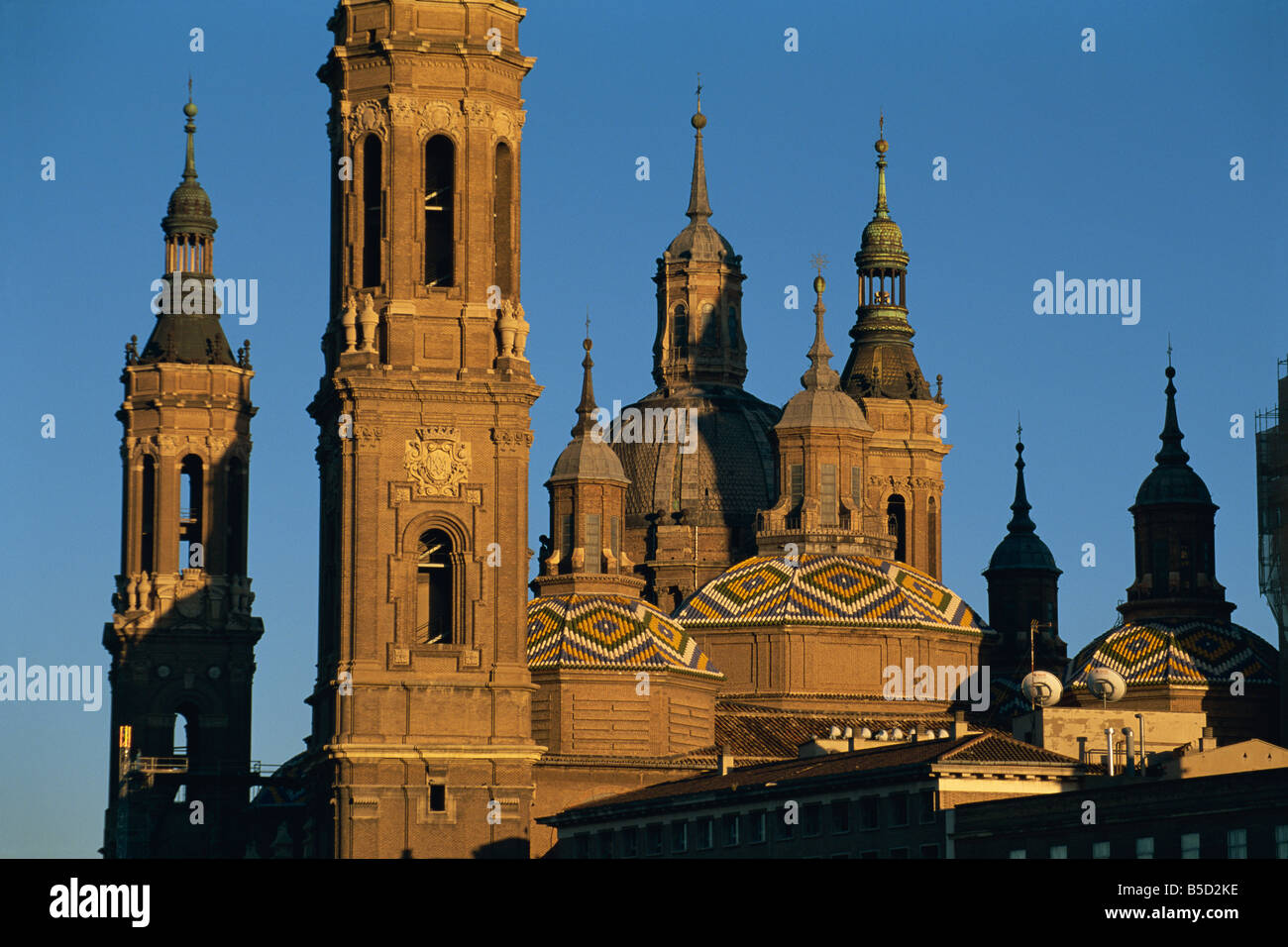 The towers spires and tiled roogs of the Basilica of Nuestra Senora del ...