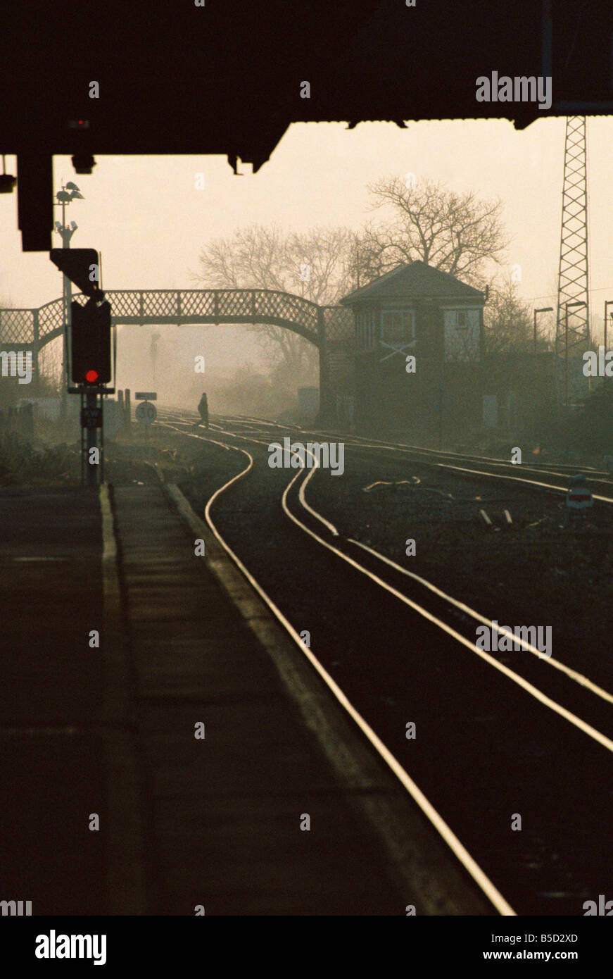 Railway lines signals and signal box in early morning mist at Havant ...
