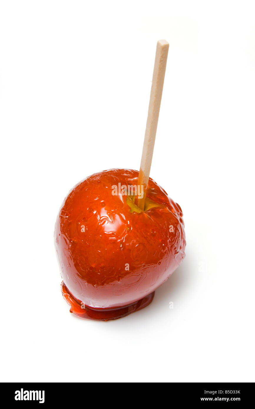 Toffee apple isolated on a white studio background Stock Photo - Alamy
