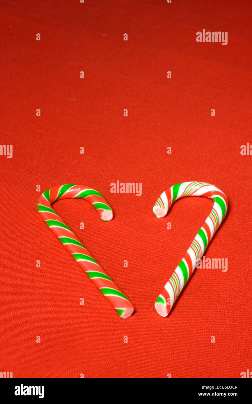 Candy cane on red Stock Photo - Alamy