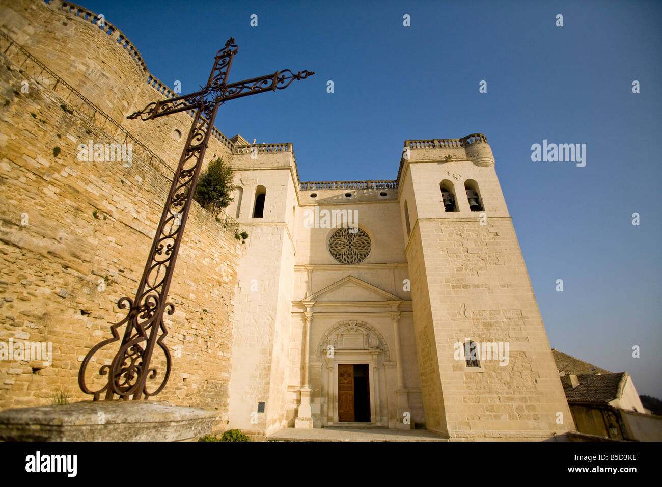 Grignan chateau. Drome France. Church square. Iron cross. blue sky ...