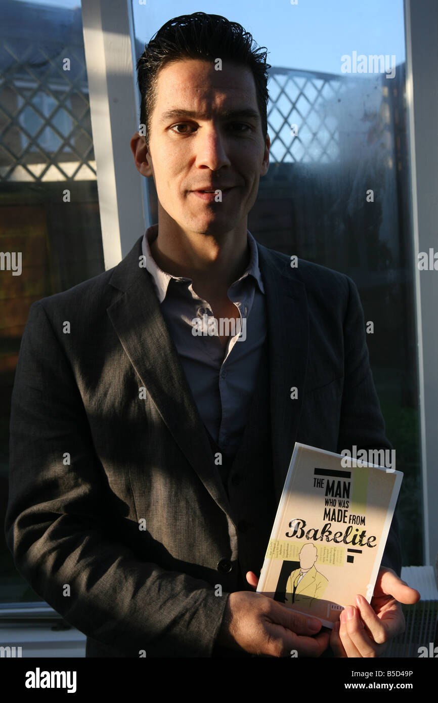 a portrait of a famous author with his newly published book in his ...