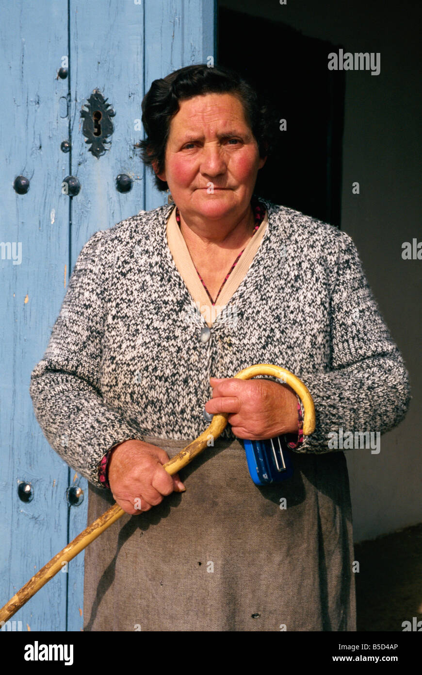 Portrait of a shepherd lady holding a crook in the Maragateria region ...