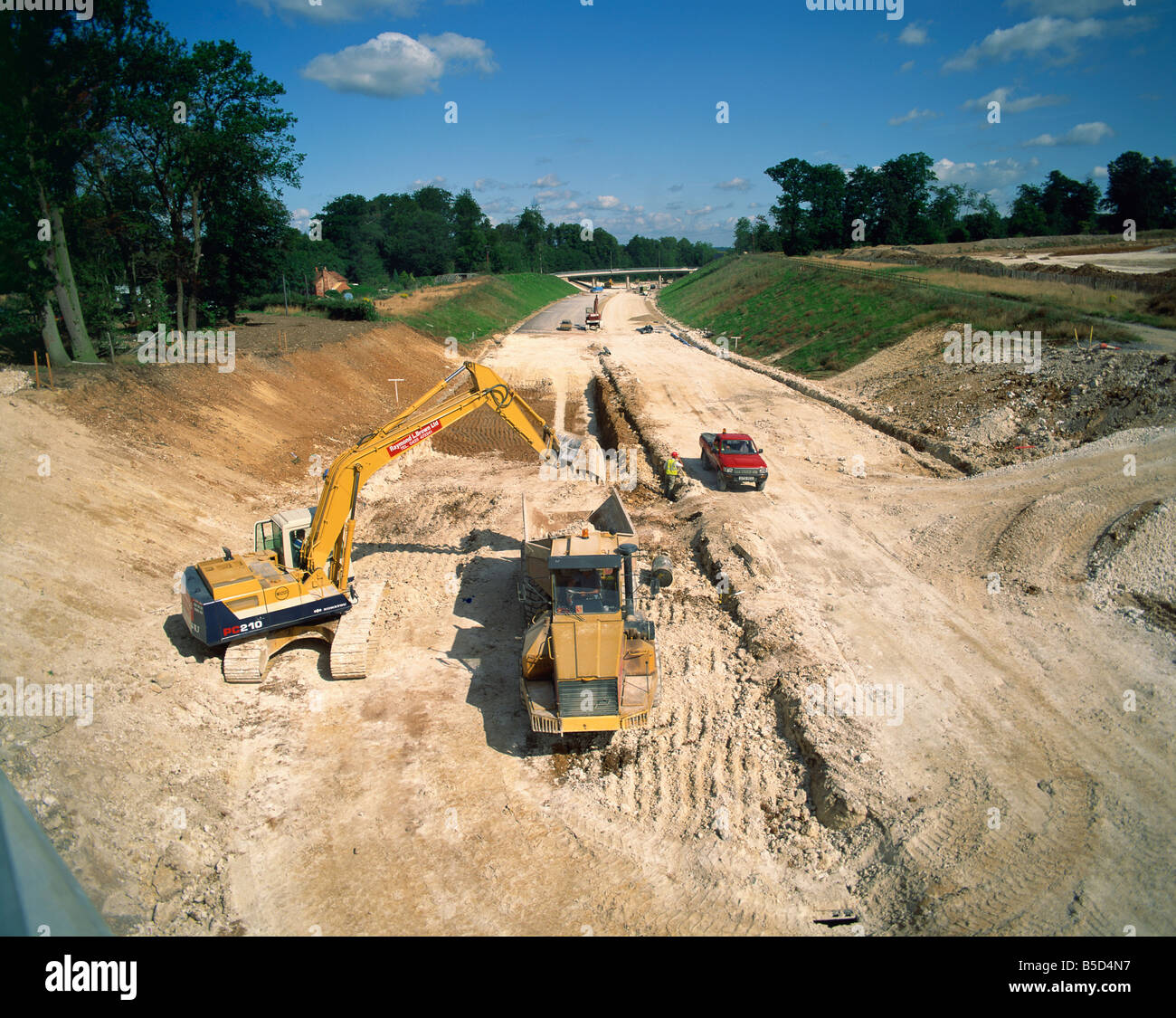 Earthmover and other machinery used in the construction of a new road ...