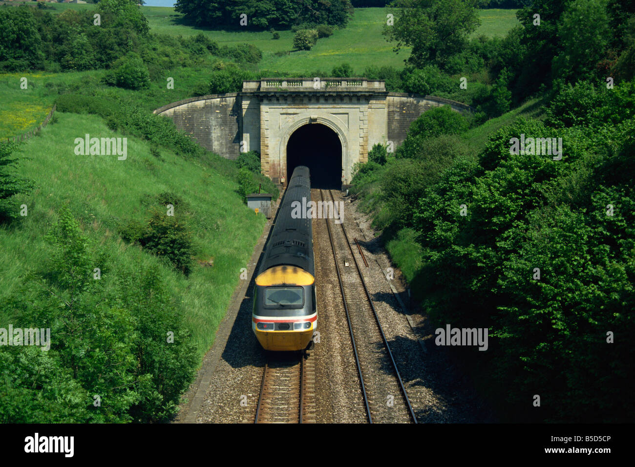 High speed train emerging from tunnel in the Box Valley Avon England UK ...