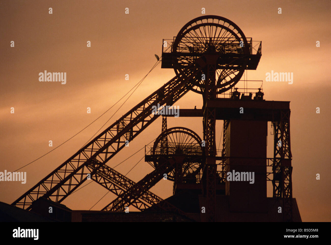 Coalmine pithead silhouetted at dusk South Wales UK C Bowman Stock ...