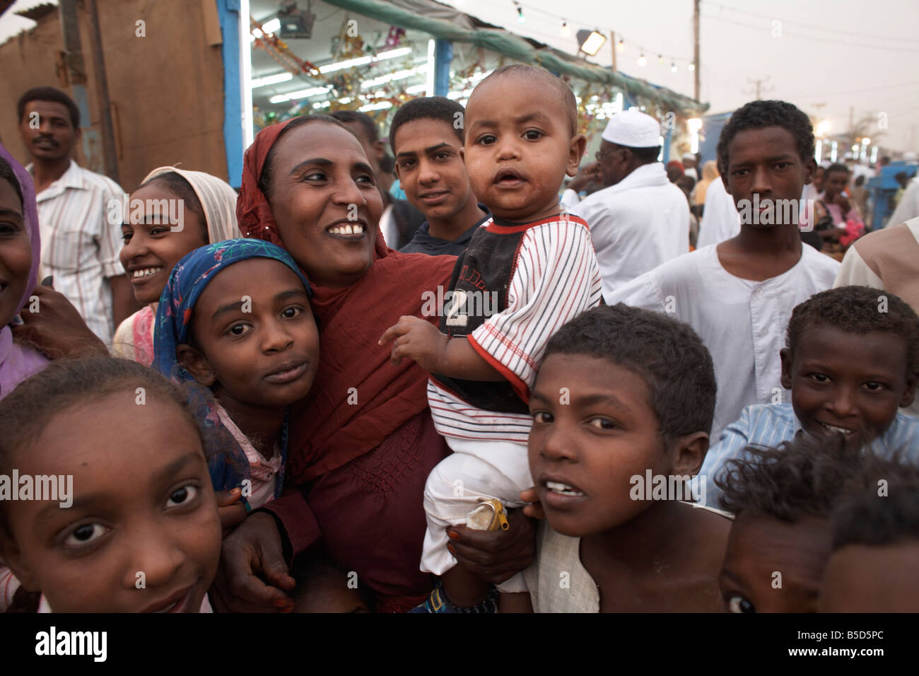 Sudanese people pose for the camera in the town of Shendi, Sudan ...