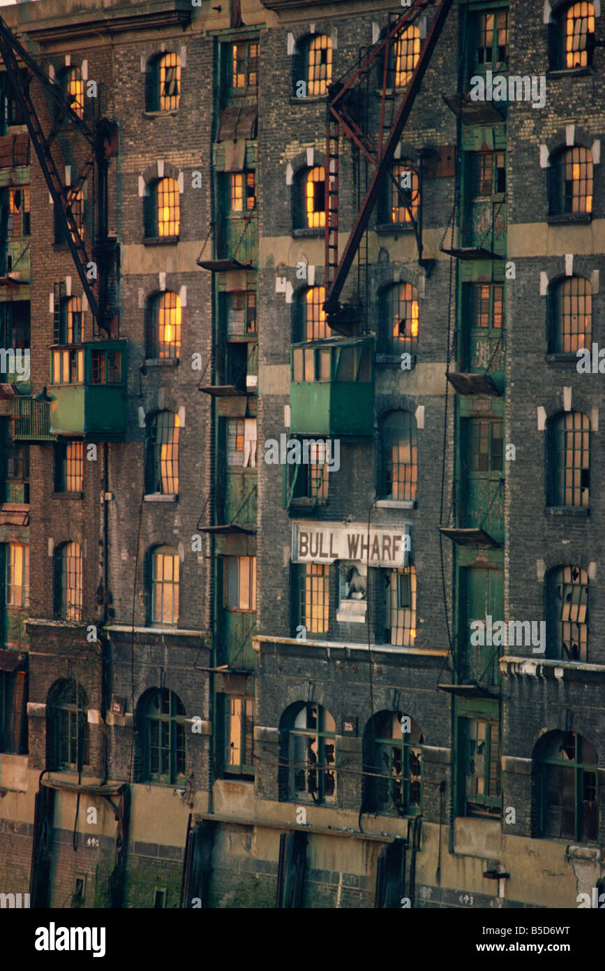 Old wharf building at dusk, Docklands, London, England, Europe Stock ...