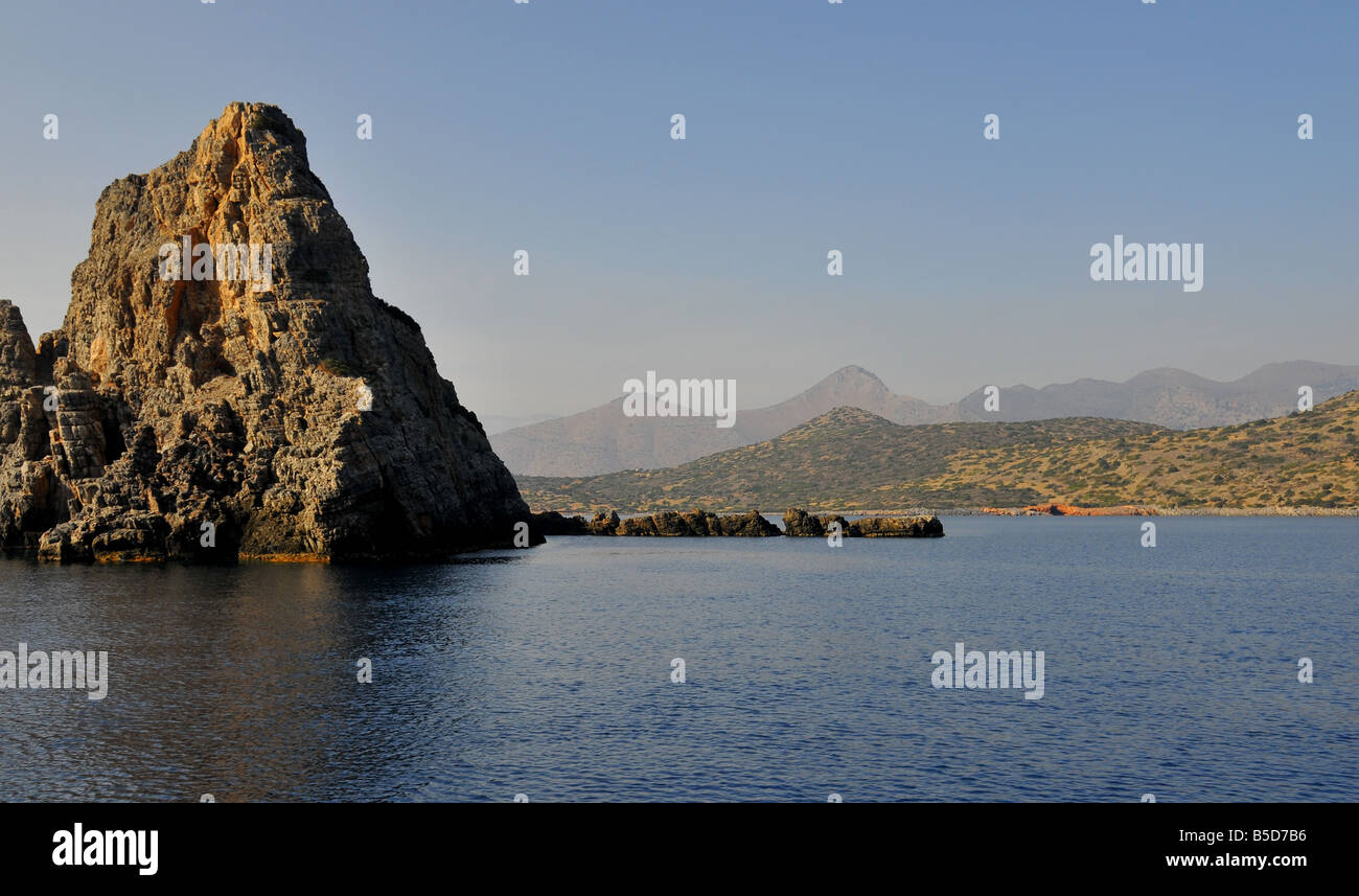 Rocks in creatan sea in the north est of Crete with moutains background ...