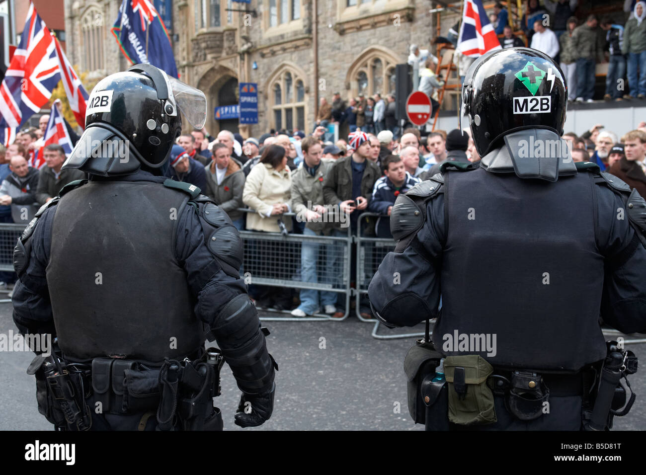 two PSNI Police Service of Northern Ireland riot control officers ...