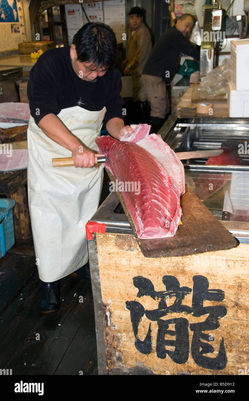 Fish being cleaned at Tsukiju Fish Market Tokyo Japan Stock Photo - Alamy