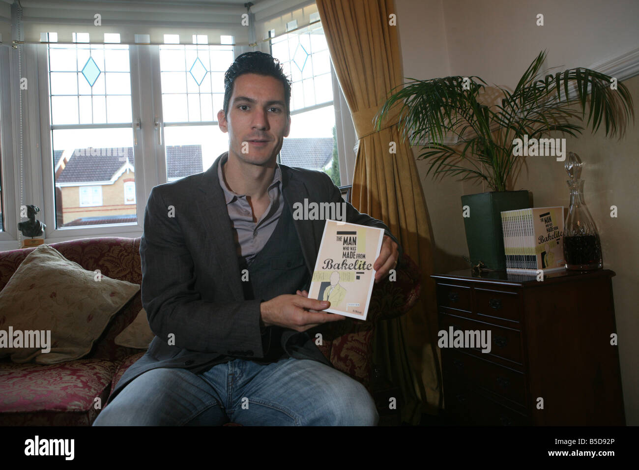 a portrait of a famous author with his newly published book in his ...