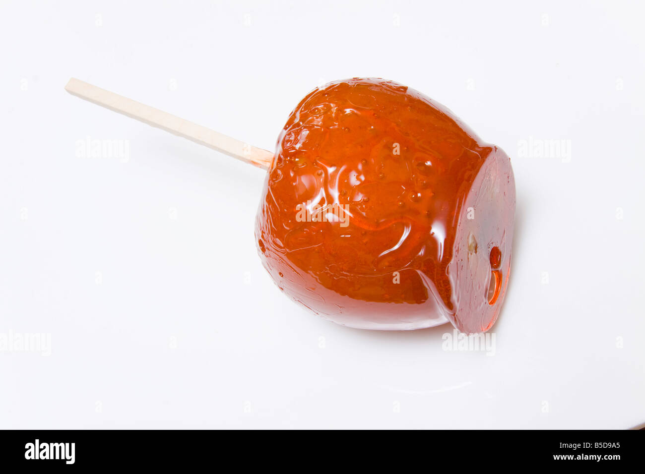 Toffee apple isolated on a white studio background Stock Photo - Alamy