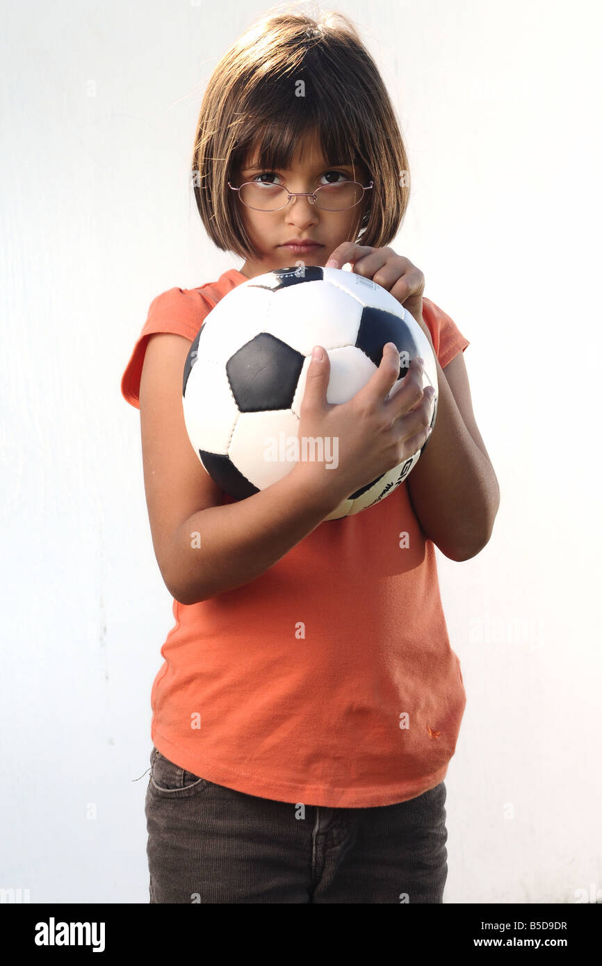 Girls playing football one girl hi-res stock photography and images - Alamy