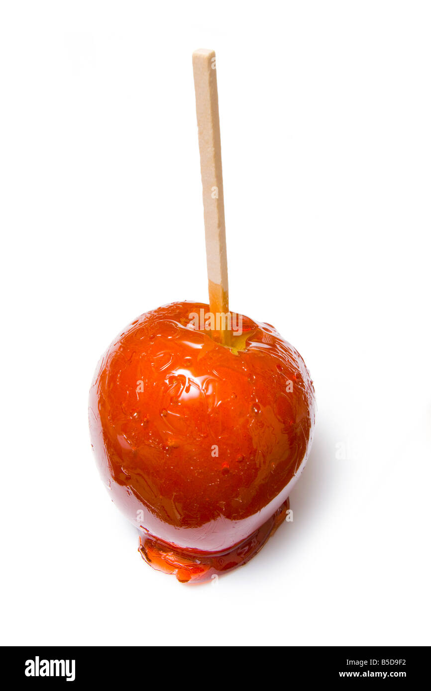 Toffee apple isolated on a white studio background Stock Photo - Alamy