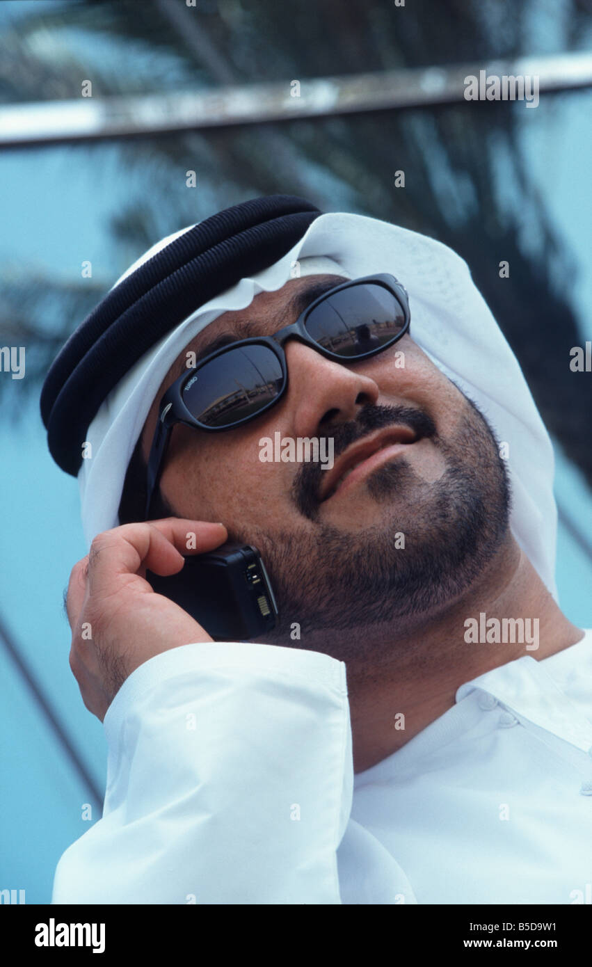 Arab businessman using mobile telephone Stock Photo - Alamy