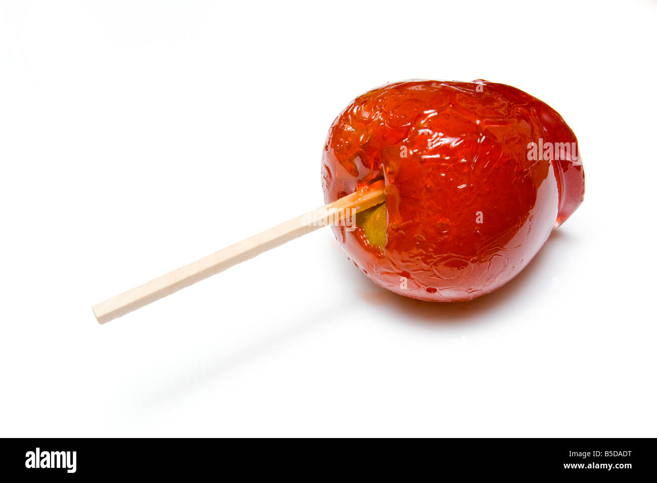 Toffee apple isolated on a white studio background Stock Photo - Alamy