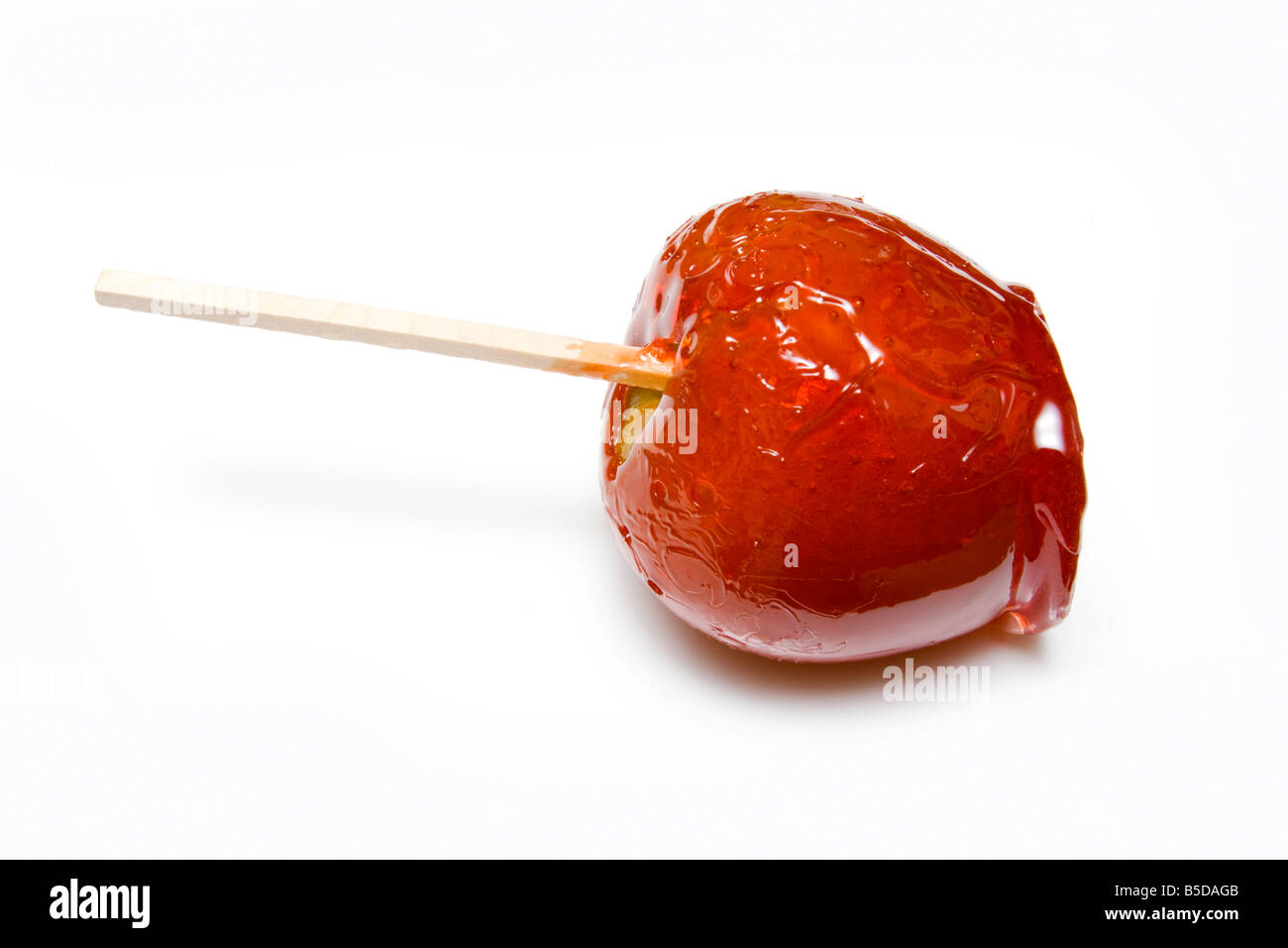 Toffee apple isolated on a white studio background Stock Photo - Alamy