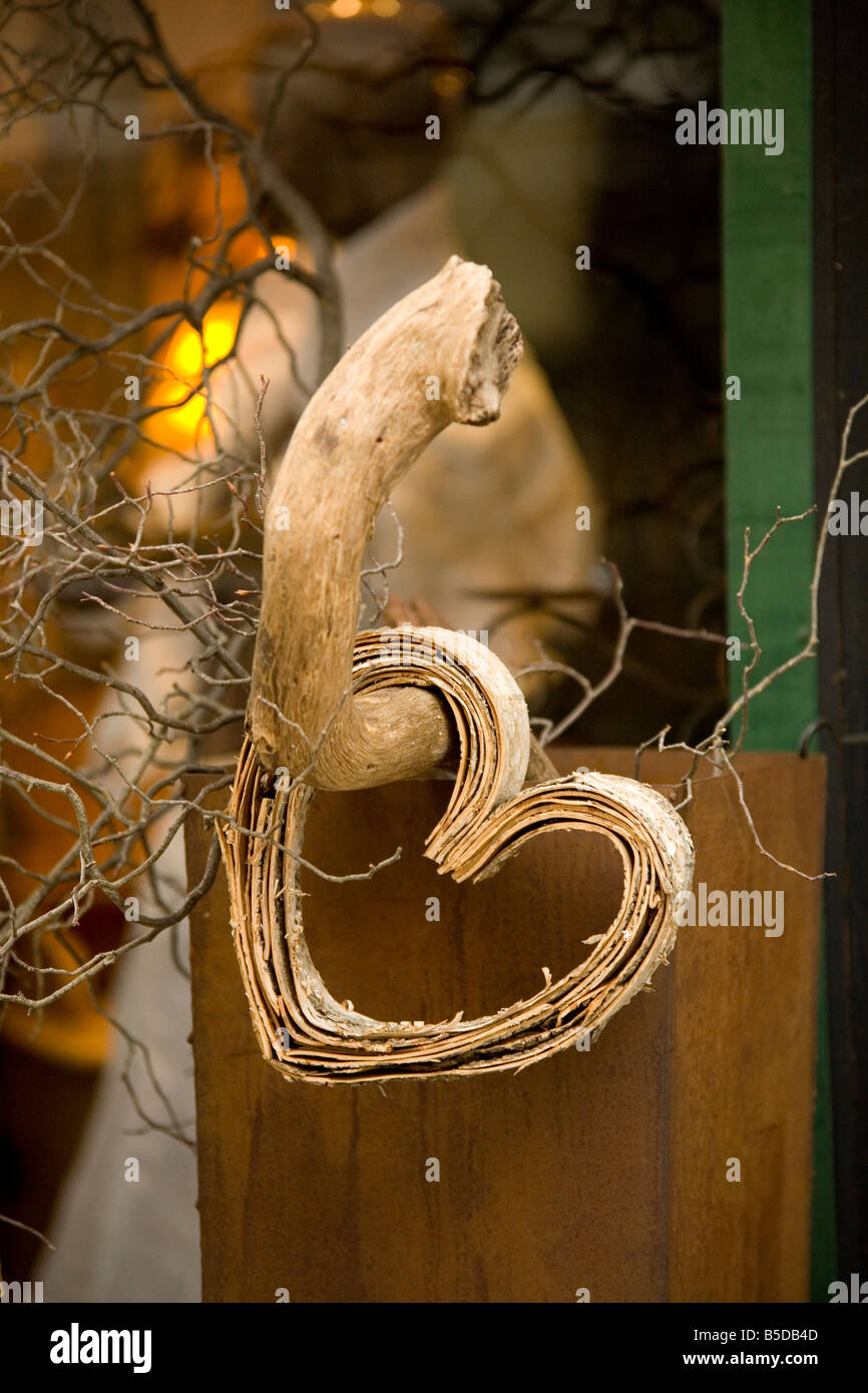 twisted raffia valentine heart hanging off a branch Stock Photo - Alamy