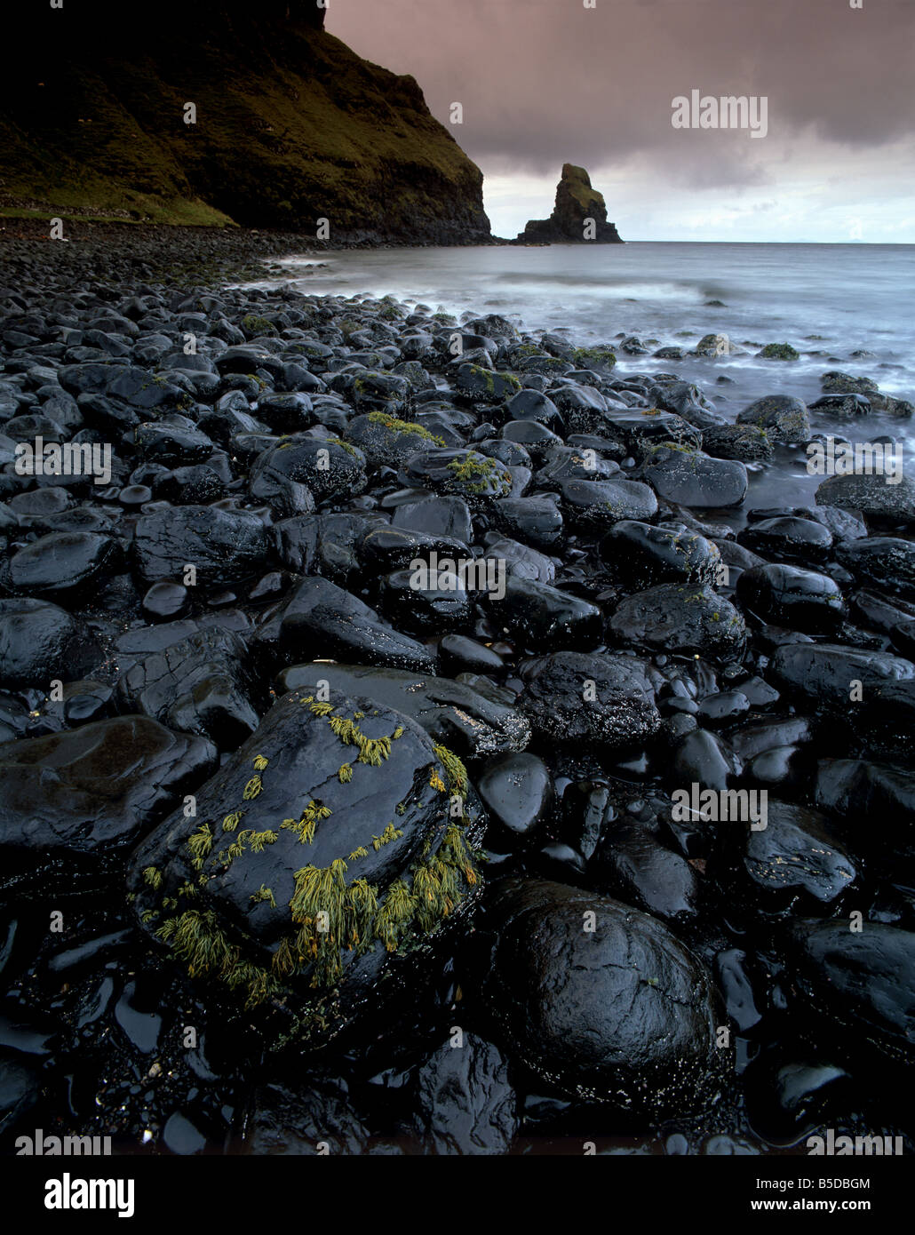 Black boulder rocks in Talisker Bay, Isle of Skye, Inner Hebrides ...