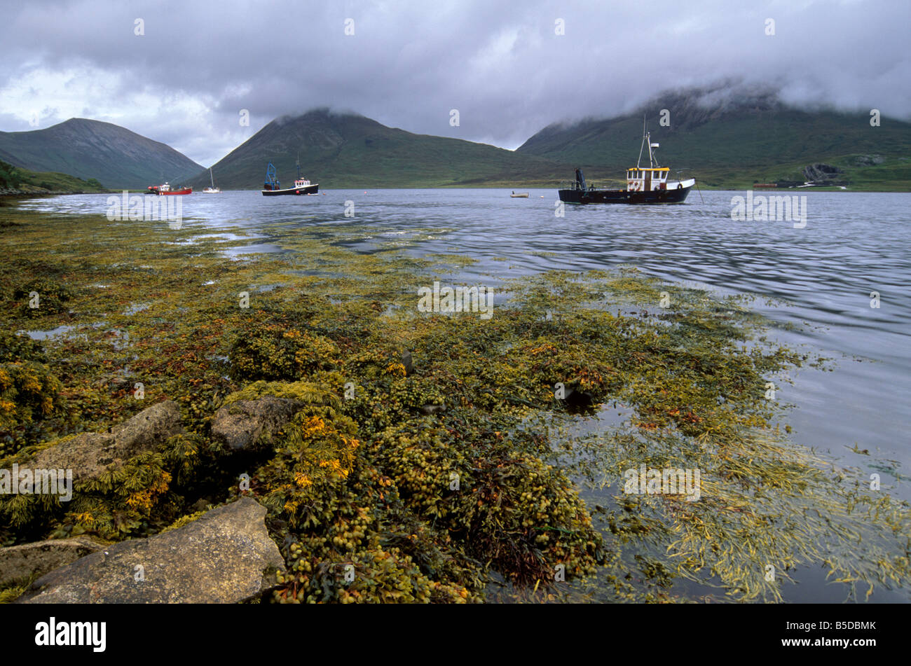 Fishing boats on Loch Slapin, Red Hills including Beinn na Cro, Beinn ...