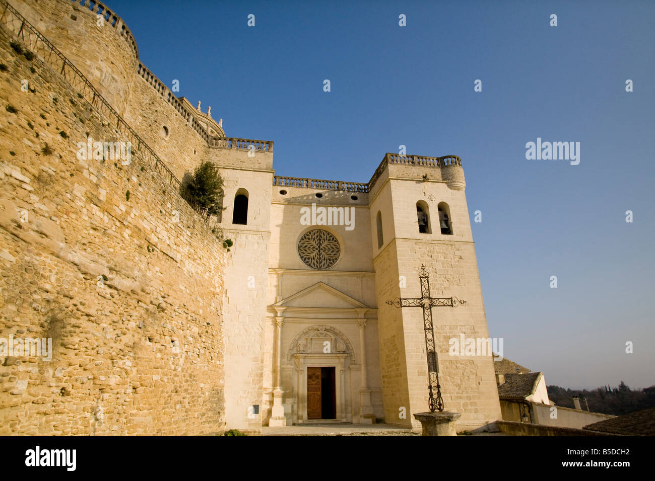 Grignan chateau. Drome France. Church square. Iron cross. blue sky ...