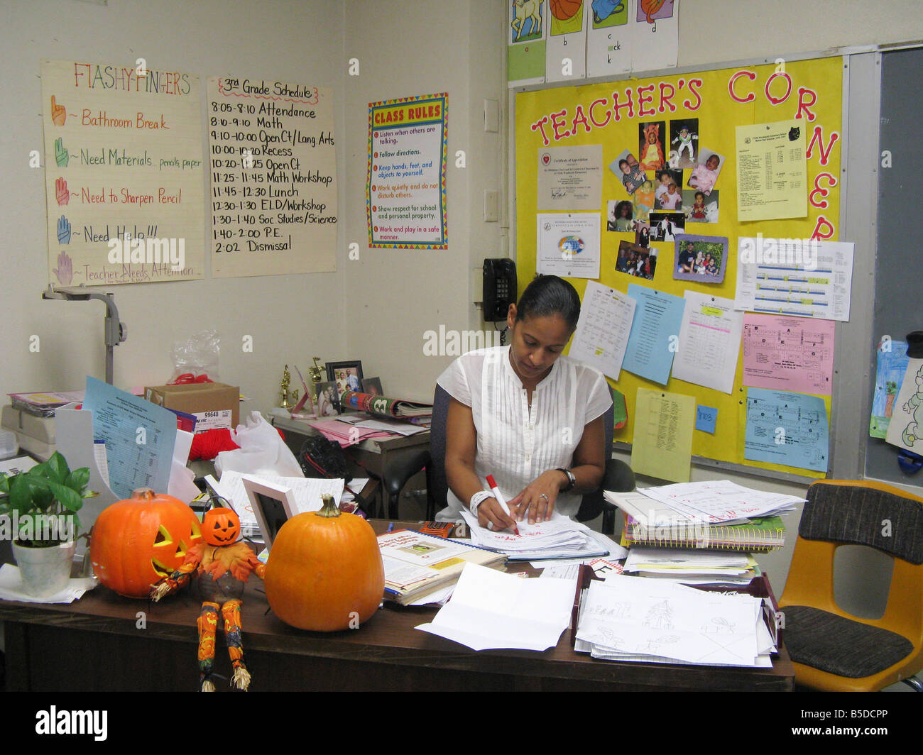 Teacher Correcting Tests Stock Photo - Alamy